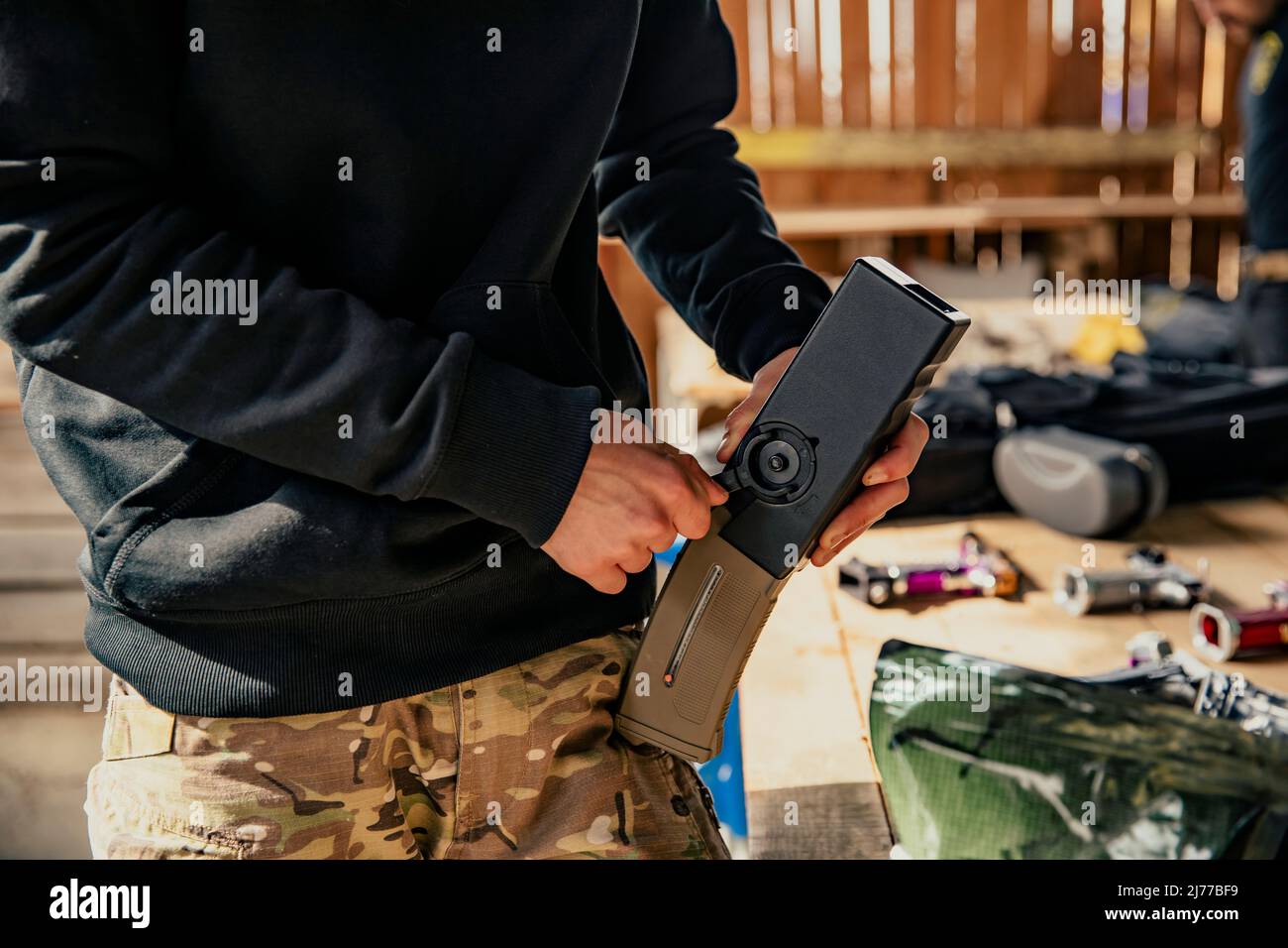 Airsoft soldier preparing for battle at training ground Stock Photo - Alamy