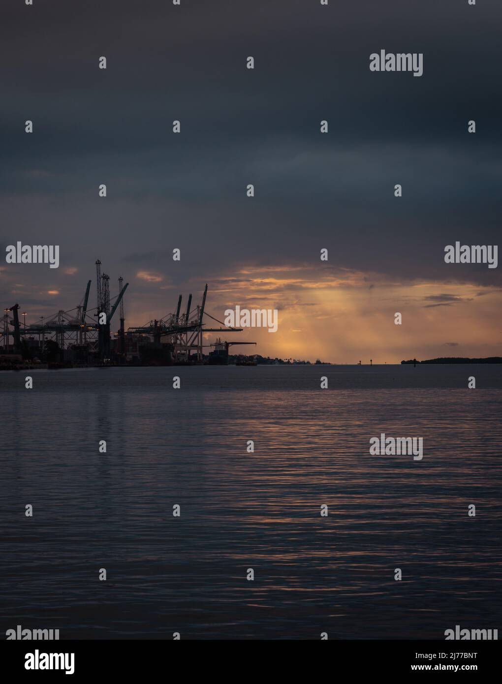 sunset in the port sun reflections sea miami Stock Photo - Alamy