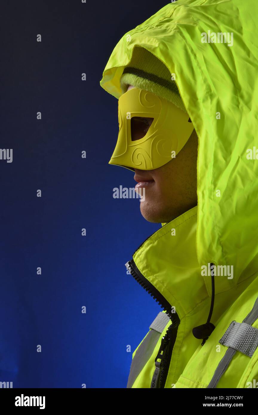 Man wearing neon mask and clothes Stock Photo - Alamy