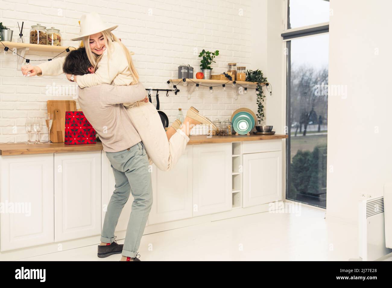 Woman flirting with man in kitchen hi-res stock photography and images ...