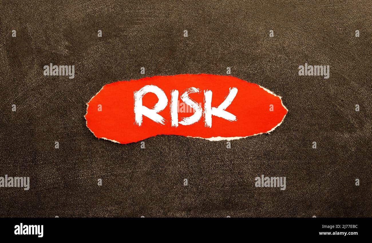 Risk single word written on red cubes against red background. Concept ...
