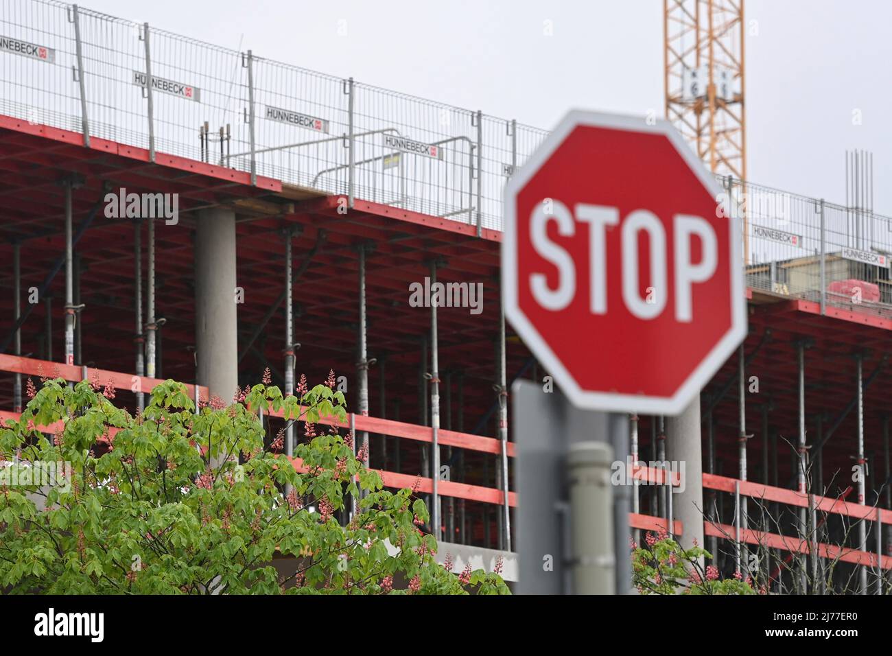 Stop sign in front of a major construction site, shell construction ...
