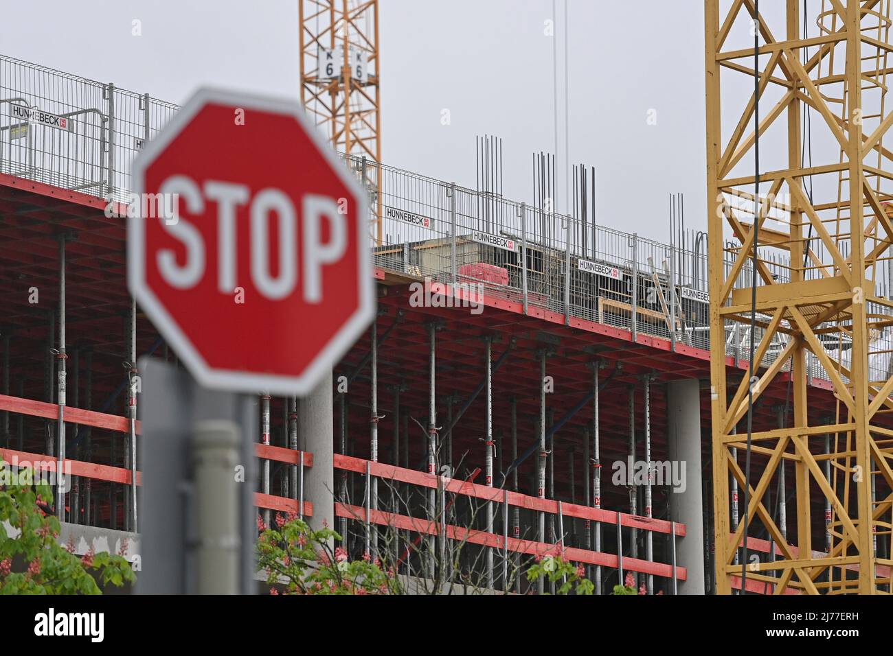 Stop sign in front of a major construction site, shell construction ...