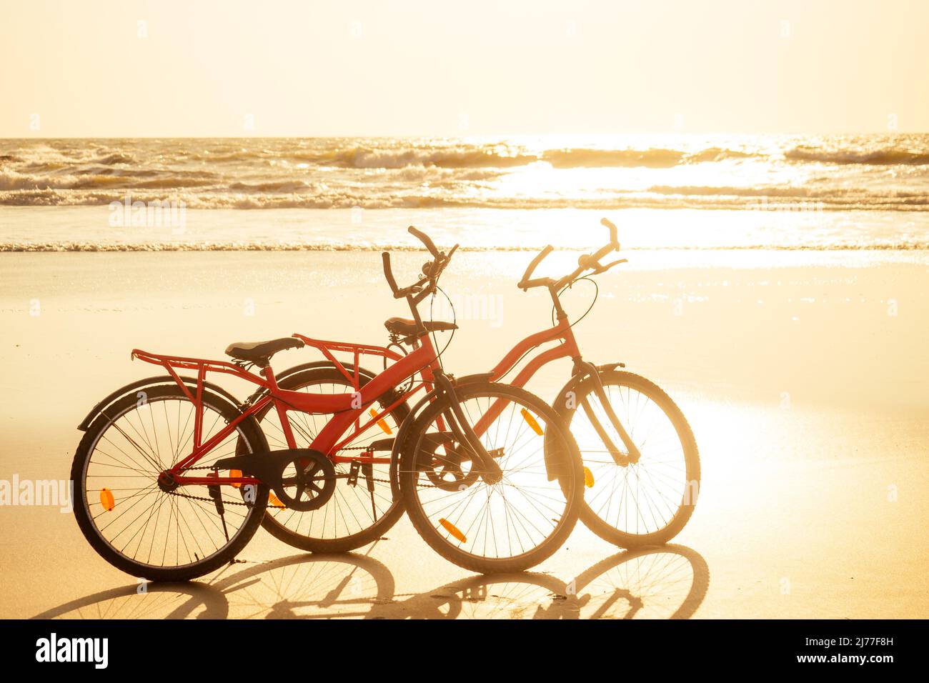 two bicycles and empty beach without people.no body at sunset Stock ...