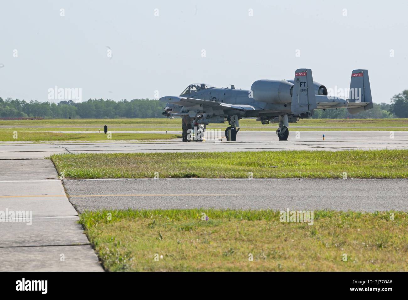 An A-10C Thunderbolt II aircraft is inspected prior to take-off at ...