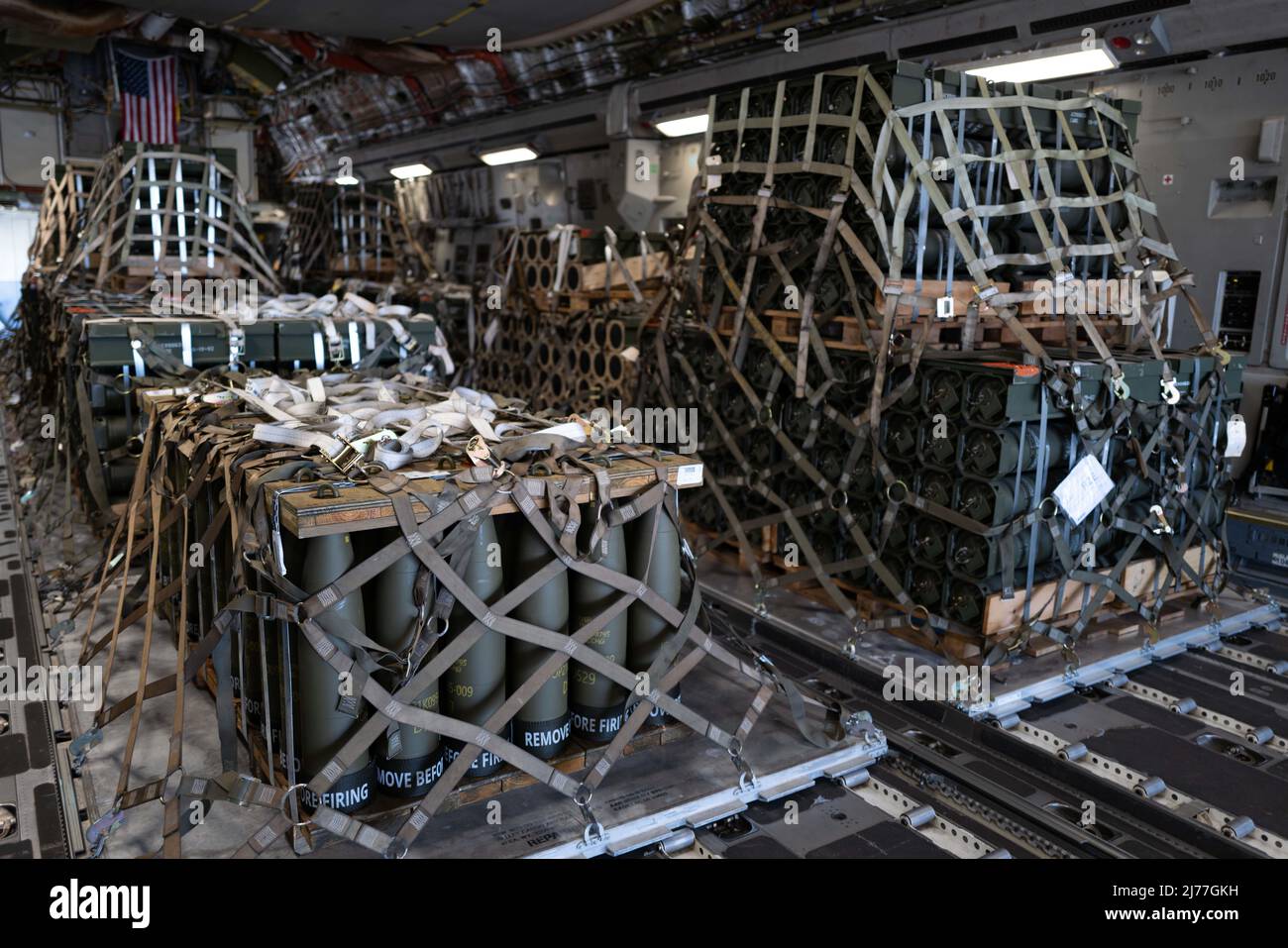 Pallets of munitions sit aboard a U.S. Air Force C-17 Globemaster III ...