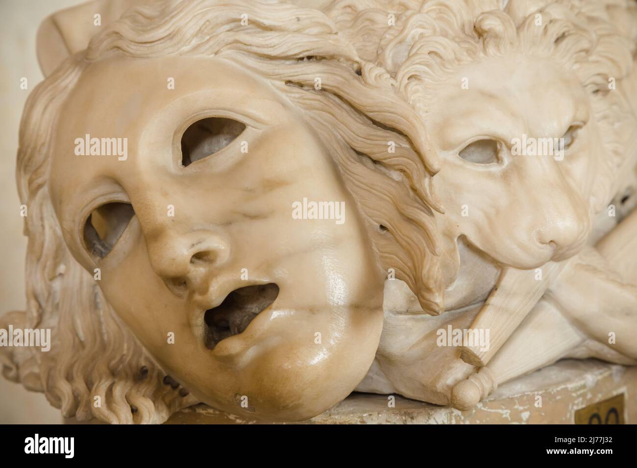 Ancient theatre mask, made of marble, located at the base of a Roman ...