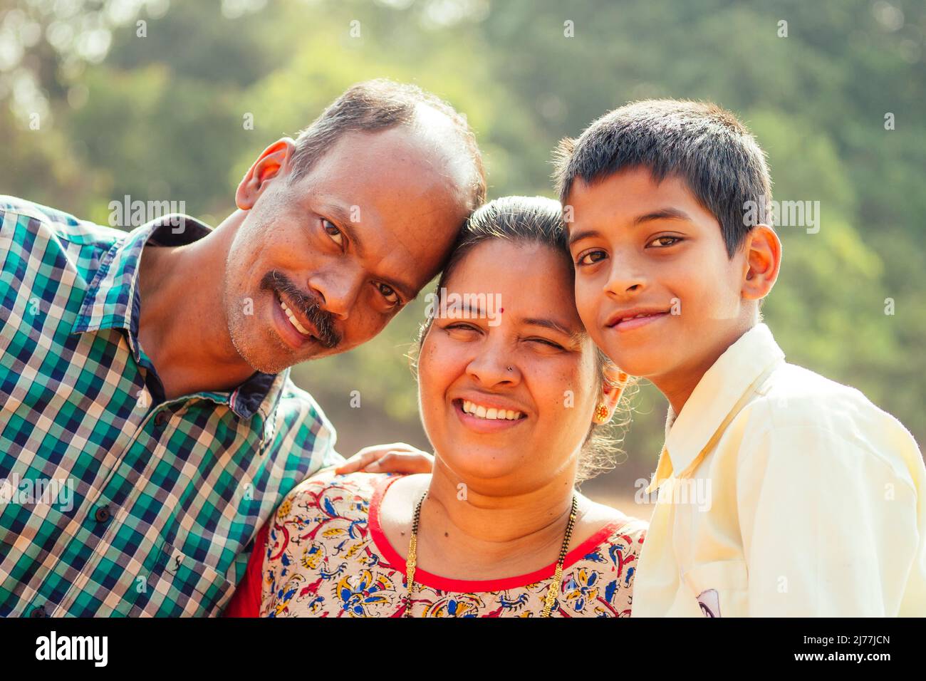 indian happy family in summer park at picnic singing a song Stock Photo ...