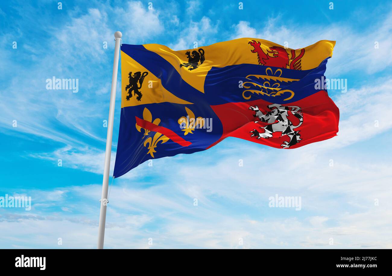 flag of Ain, France at cloudy sky background on sunset, panoramic view ...