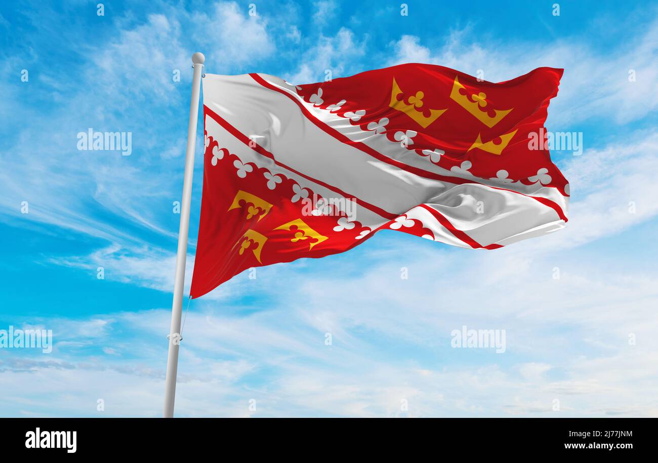 flag of Alsace, France at cloudy sky background on sunset, panoramic ...