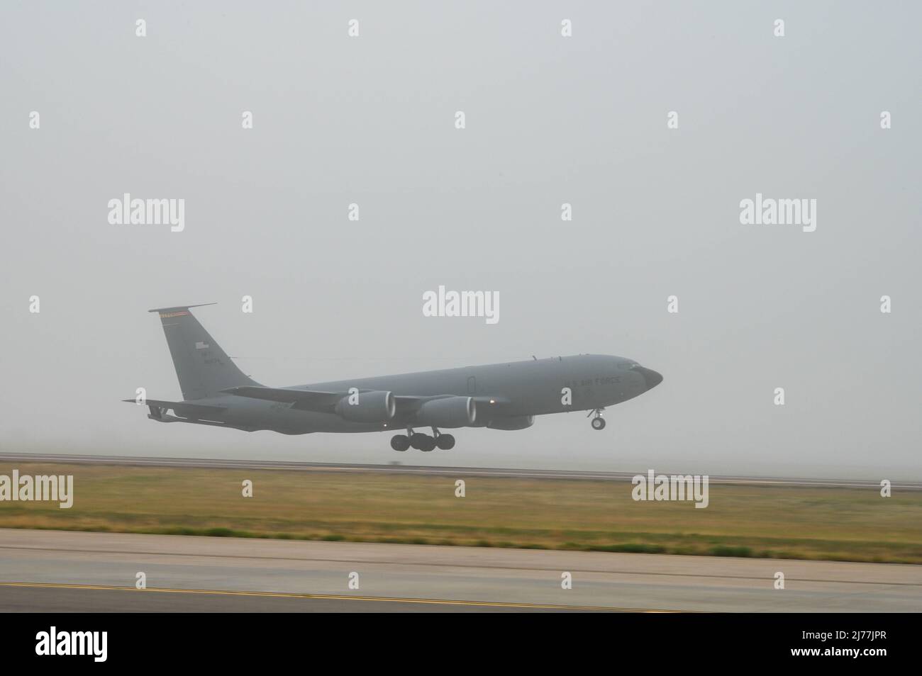 A KC-135 Stratotanker takes off due to an incoming severe weather ...