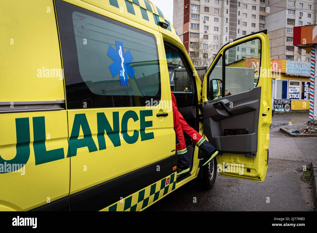 A paramedic enters the ambulance as they get ready to transport the ...