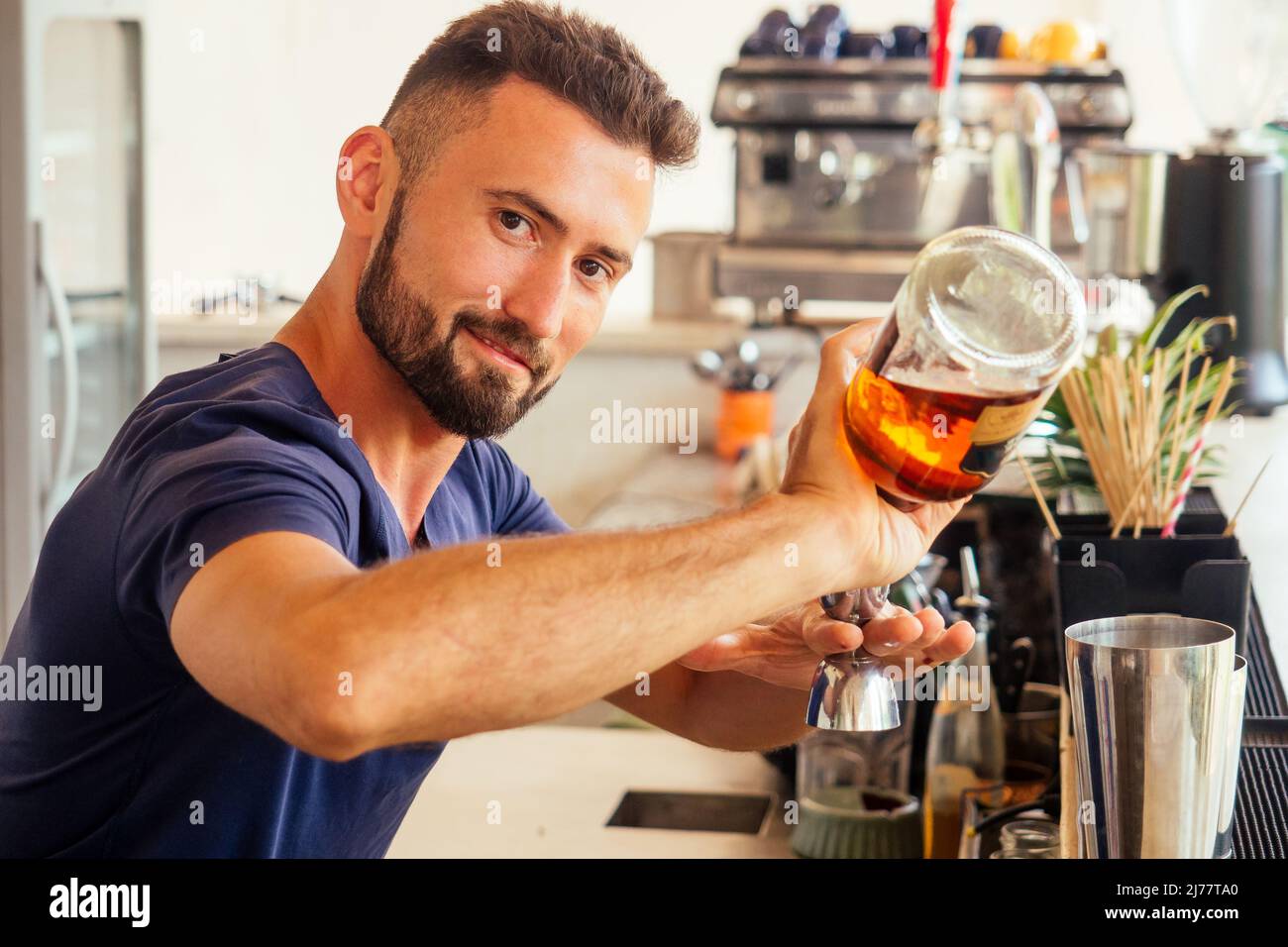 arabic man bartender making fresh coctail for lady Stock Photo - Alamy