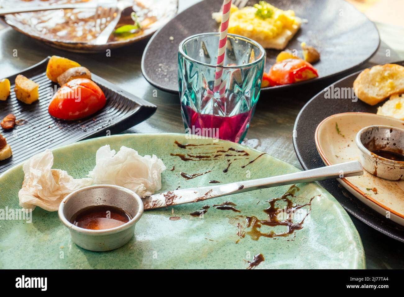 dirty dishes plates and glass on the table in cafe Stock Photo - Alamy