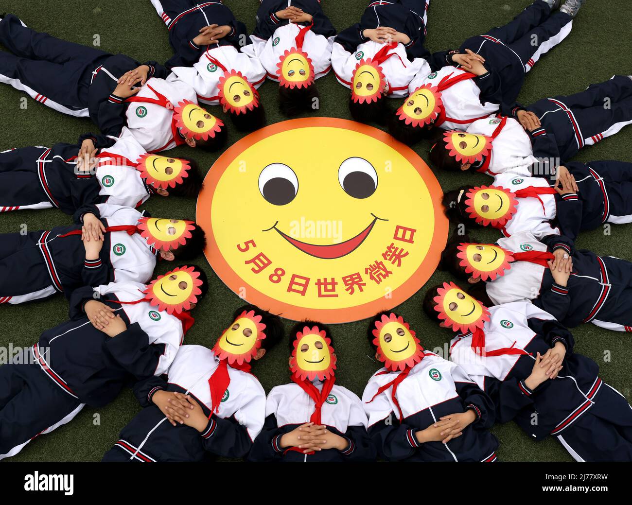 ZAOZHUANG, CHINA - MAY 6, 2022 - Primary school students pose for a ...