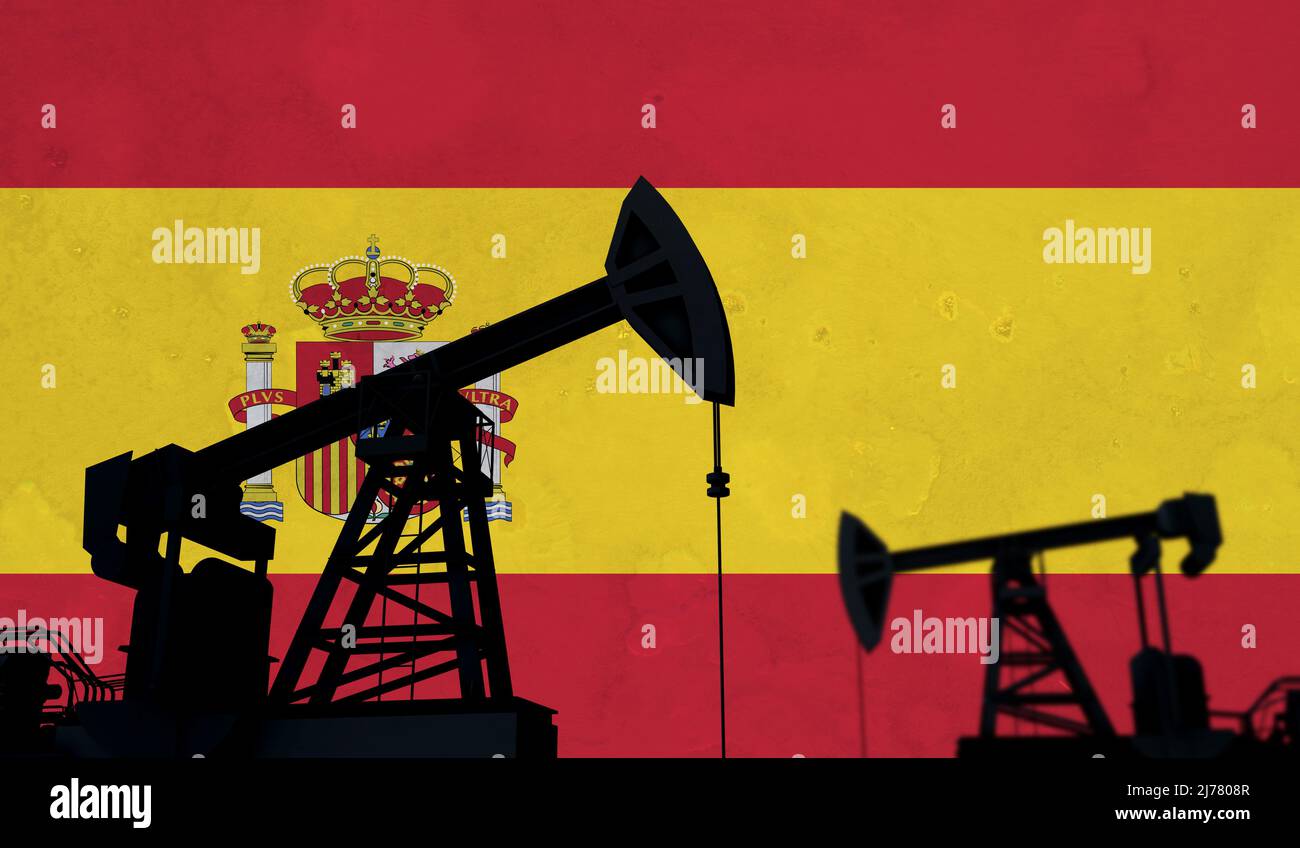 Oil and gas industry background. Oil pump silhouette against spain flag ...