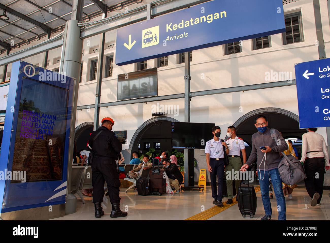 A view of Pasar Senen Station Arrival Gate. Home-comers using a train ...