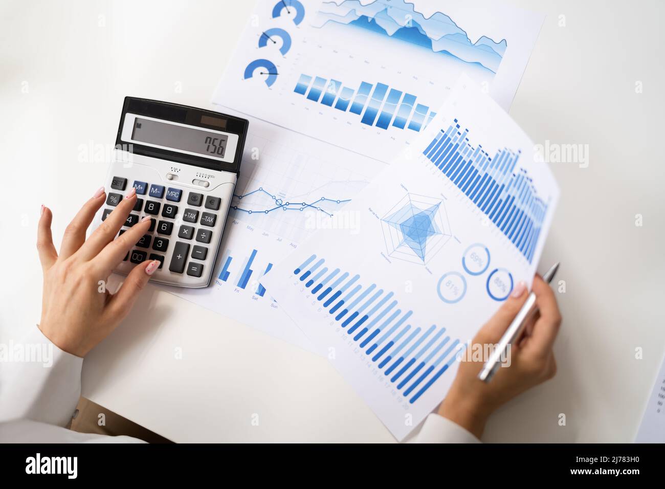 Business Accountant Using Finance Chart Document And Calculator Stock ...