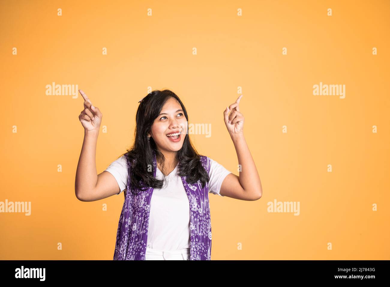 woman with finger pointing up hand gesture on isolated background Stock ...