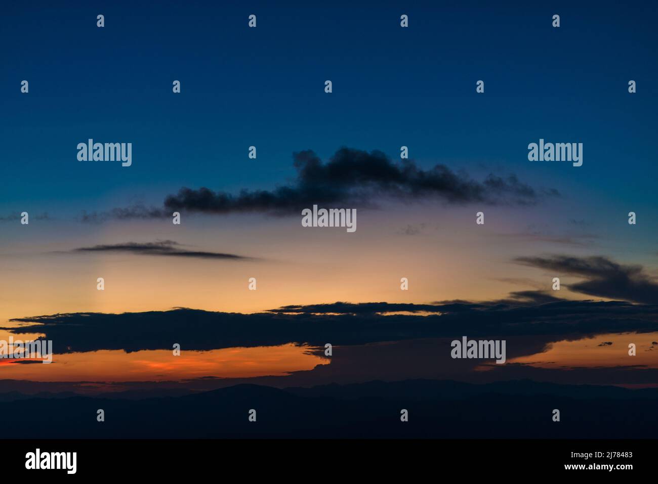 Colorful cumulus sunset sky clouds with sun setting down nature ...