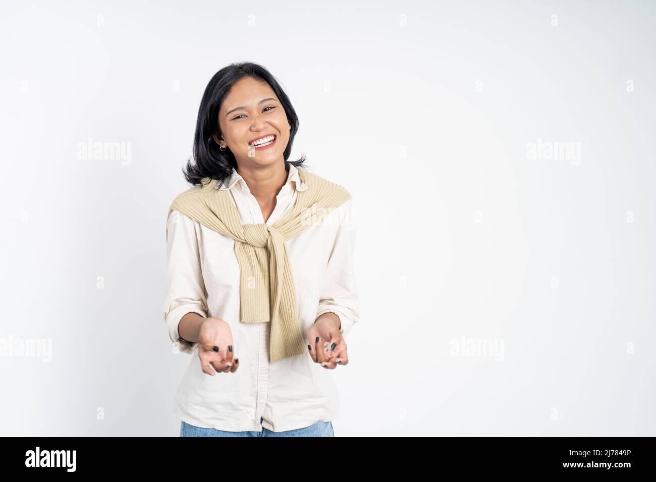 asian woman clenching hands while celebrating success Stock Photo - Alamy