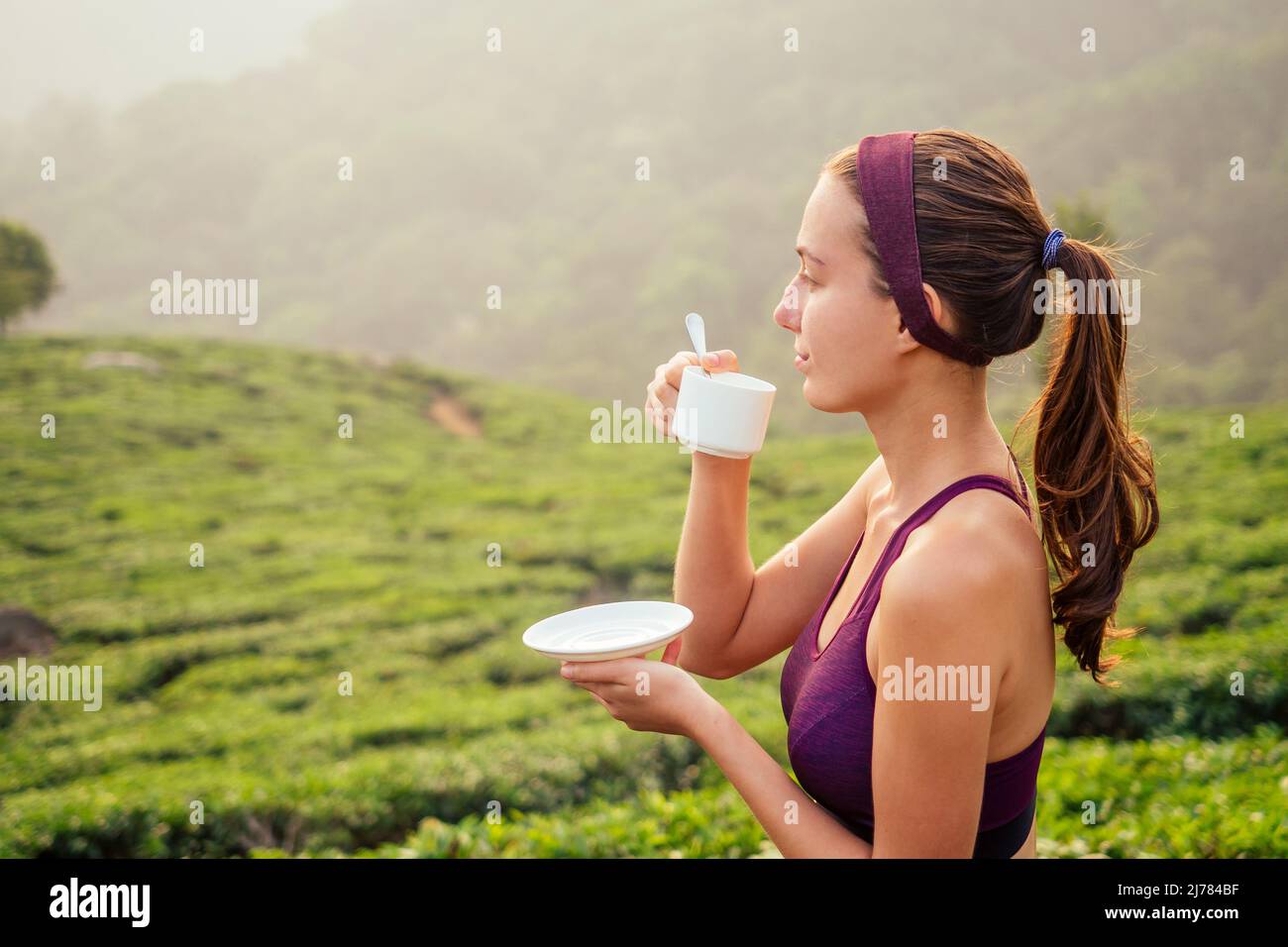 woman drinking tea cup factory in India Munnar Stock Photo - Alamy