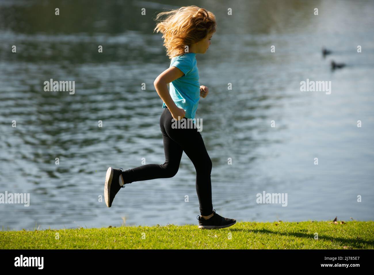 Child boy running outdoors. Kid running in a summer park Stock Photo ...