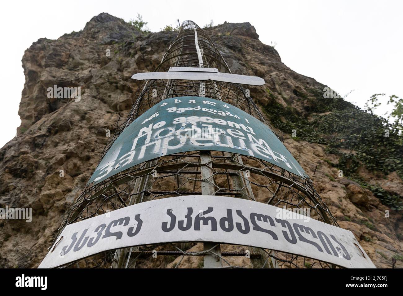 Iron ladder on Katskhi Pillar with ancient church on top in Chiatura ...