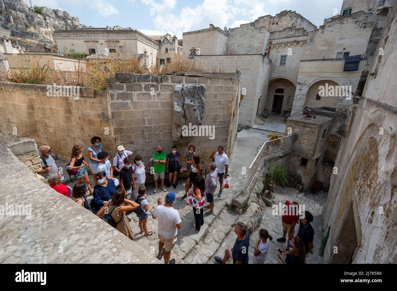 Matera, Basilicata, Italy. August 2021. Group of people in a circle ...