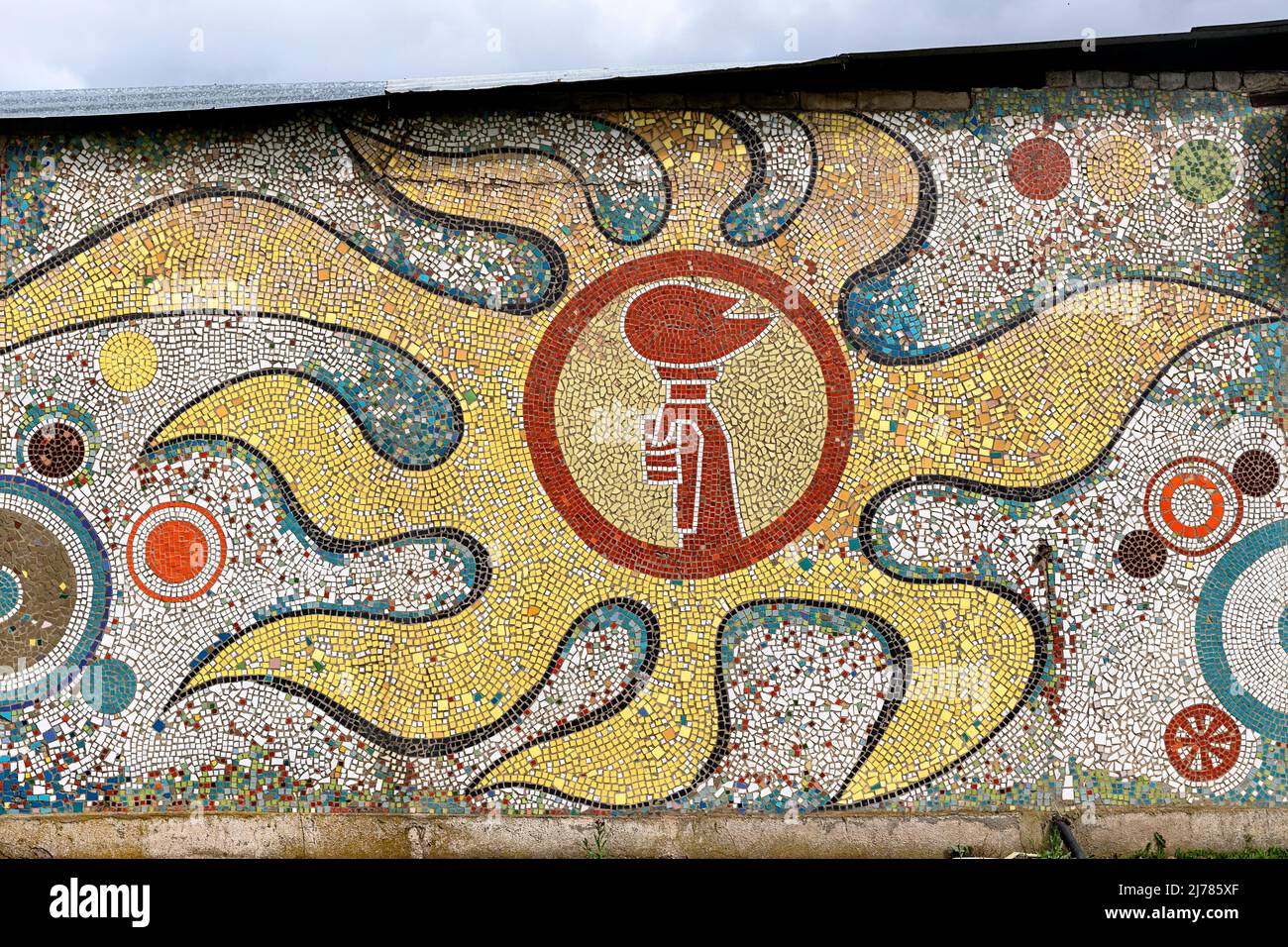 Soviet Mosaic on a building in Georgia, hand carrying a torch in a ...