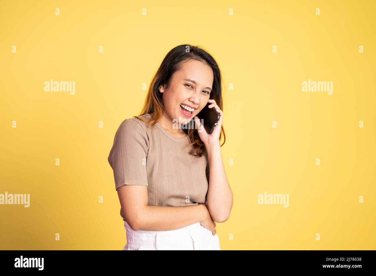 woman making a call using a cell phone on isolated background Stock ...