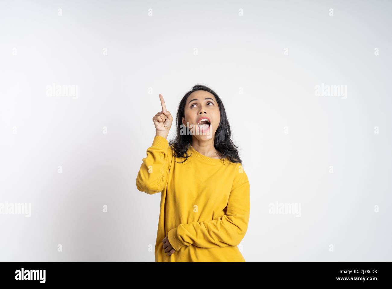 woman with finger pointing up hand gesture on isolated background Stock ...