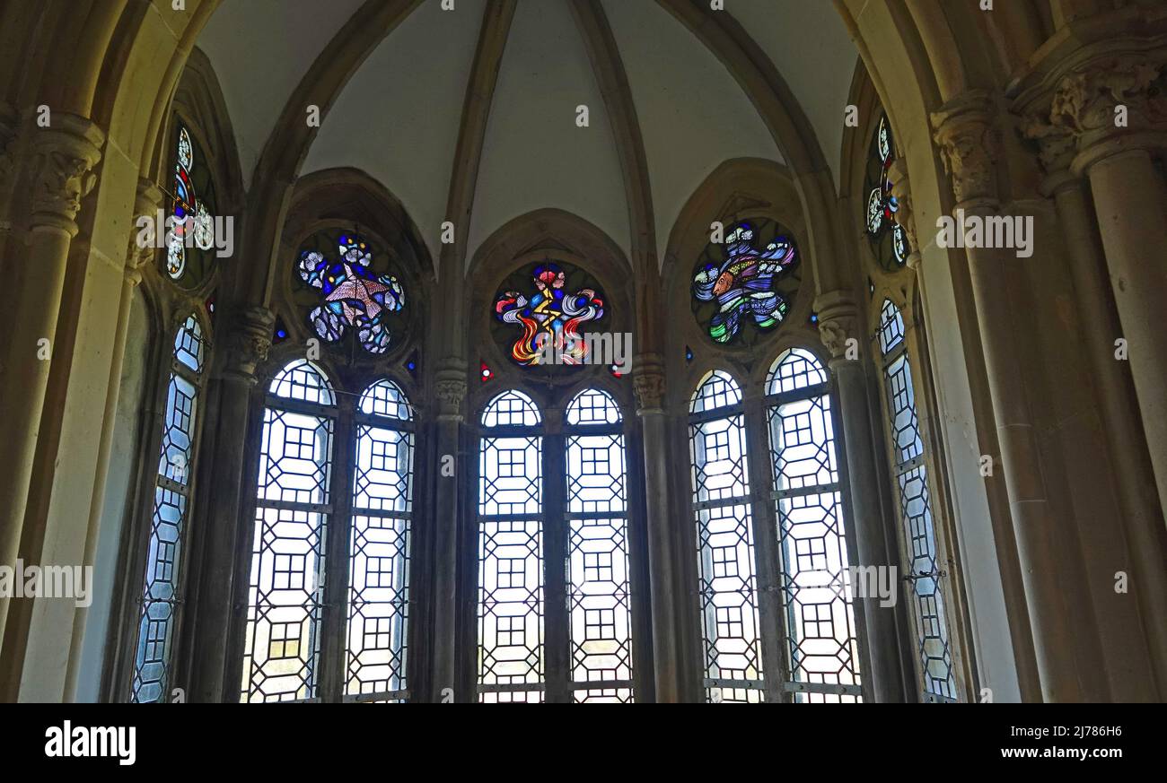 A beautiful stained glass window in an old manor. It's the upper side ...
