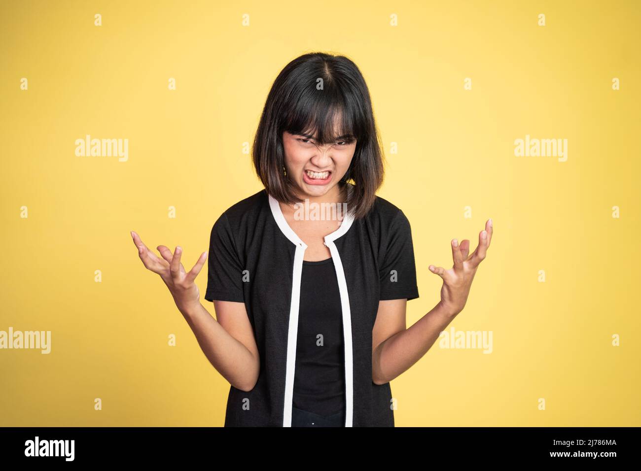 angry asian woman screaming and shouting isolated Stock Photo - Alamy