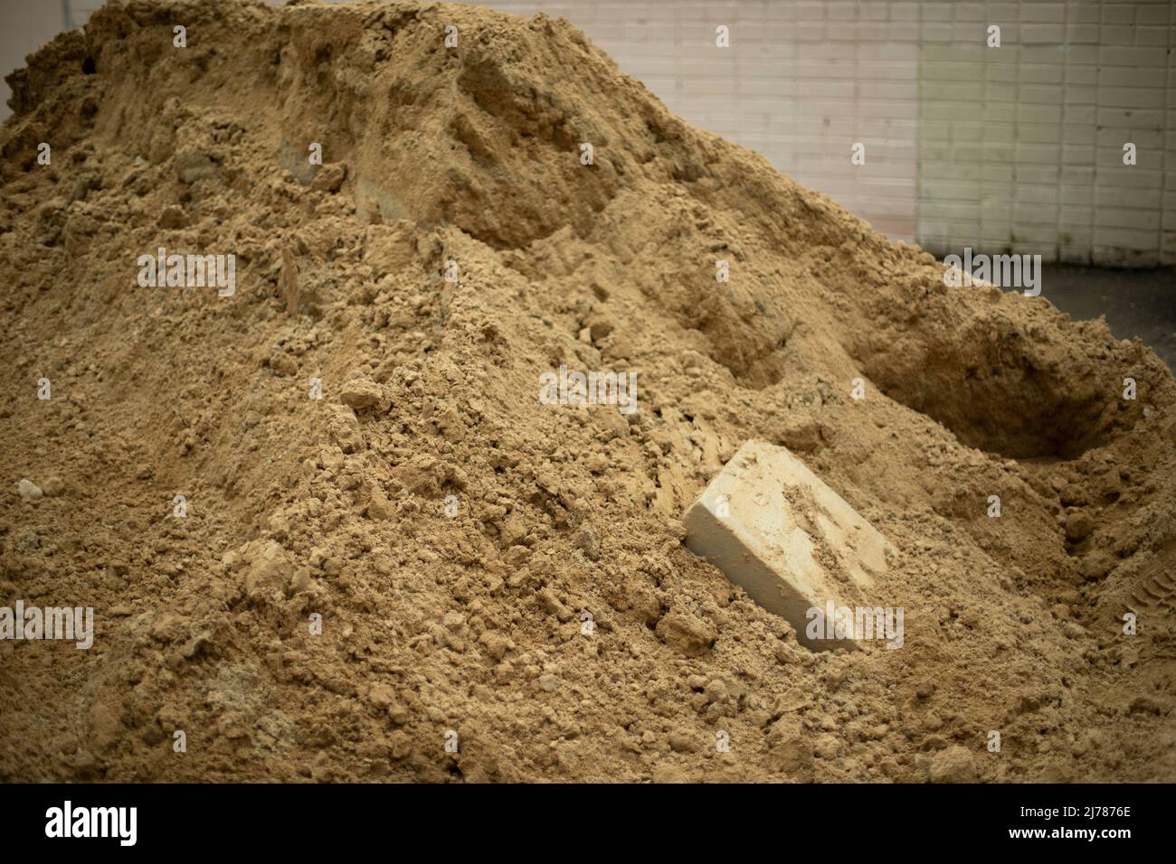 Construction sand. Pile of sand at construction site. Small bulk ...