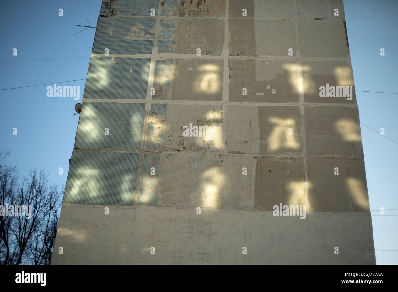 Light on wall of house. Reflection from windows on wall. Light shows ...