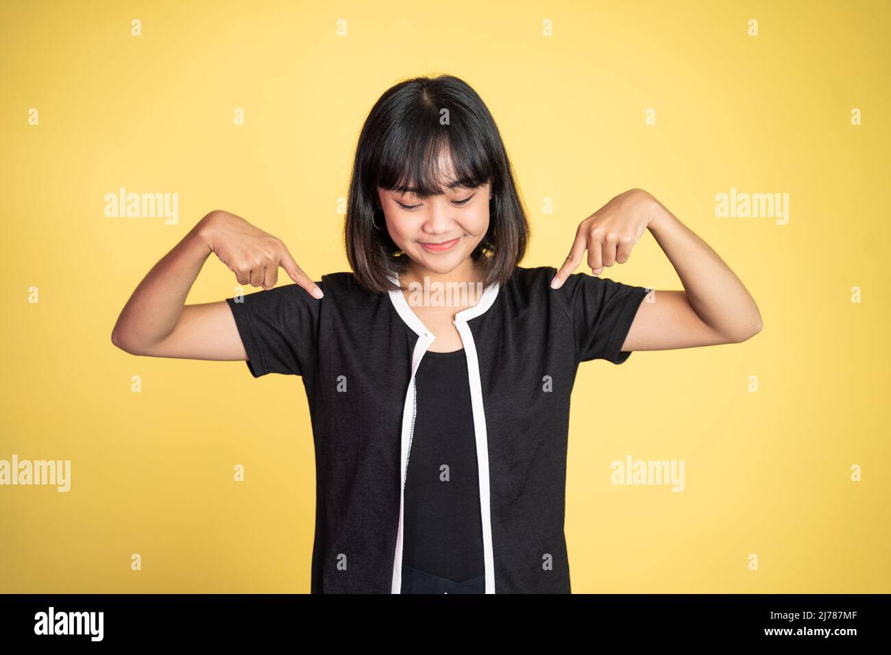 woman with finger pointing down hand gesture on isolated Stock Photo ...