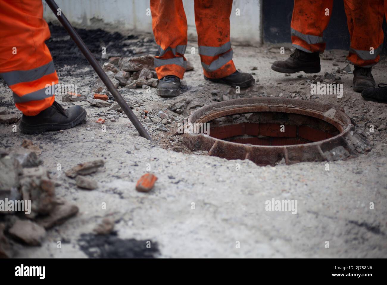 Road repair. Installation of curbs on the highway. The workers are ...