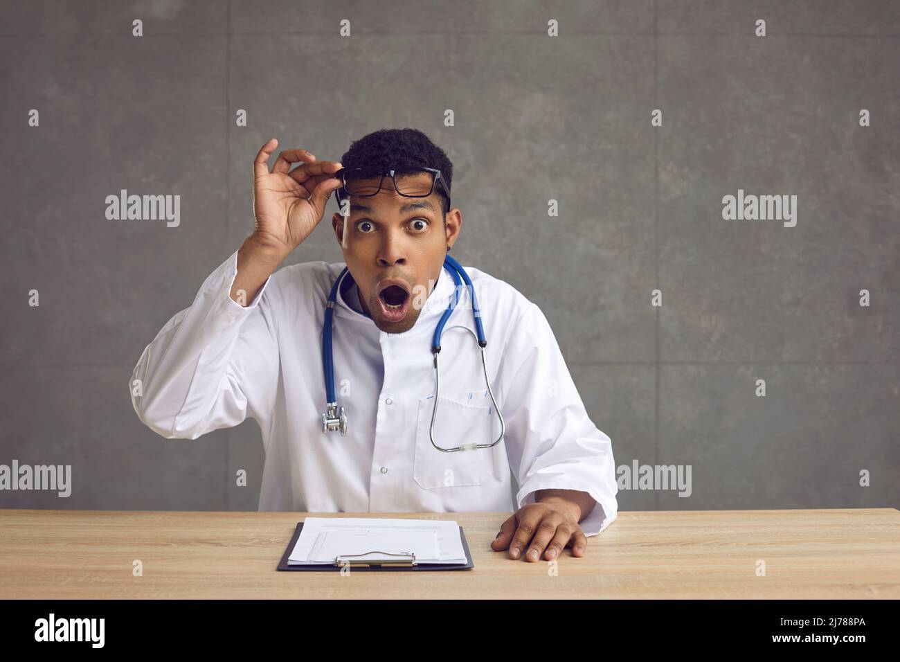 Shocked african american doctor with funny amazed facial expression ...