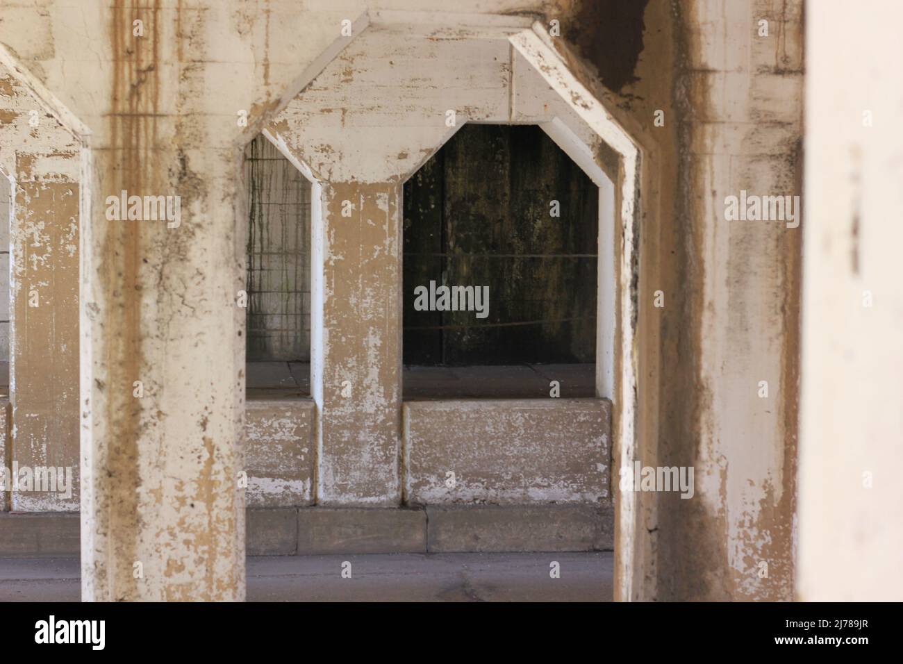Arcade of concrete columns hold up the railroad bridge Stock Photo - Alamy