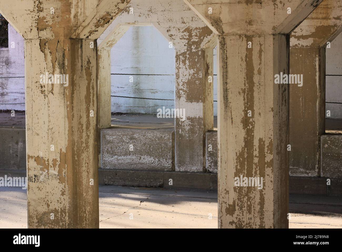 Arcade of concrete columns hold up the railroad bridge Stock Photo - Alamy