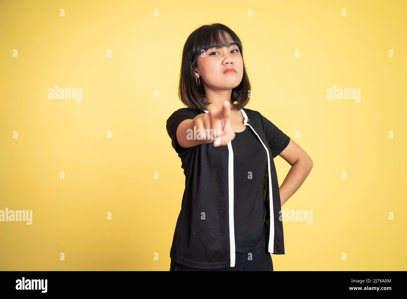 angry asian woman with finger pointing to camera Stock Photo - Alamy