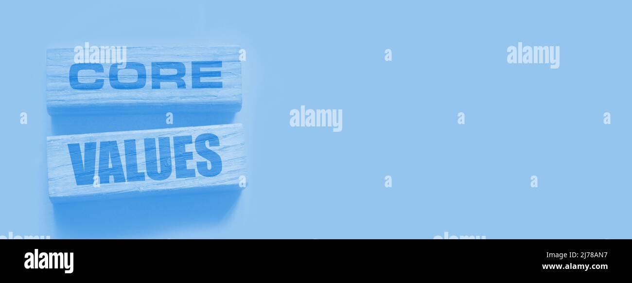 core values words on wooden blocks on yellow background. Business ...
