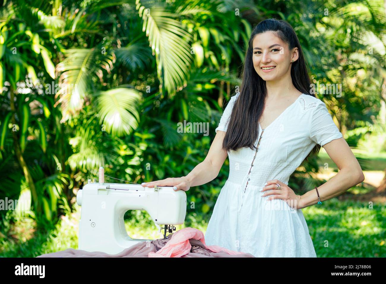 indian female sewing outdoors in summer park Stock Photo - Alamy