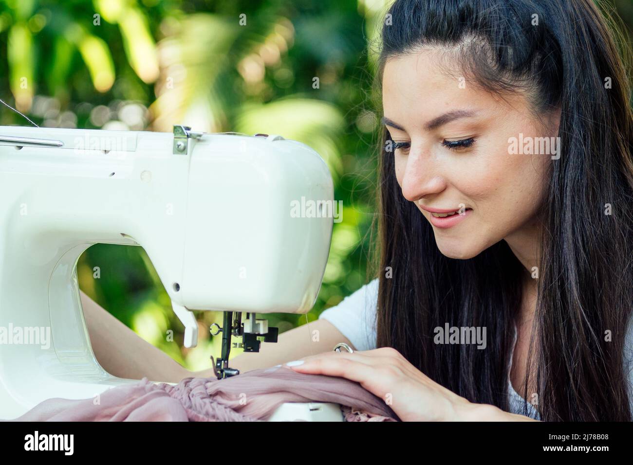 indian female sewing outdoors in summer park Stock Photo - Alamy