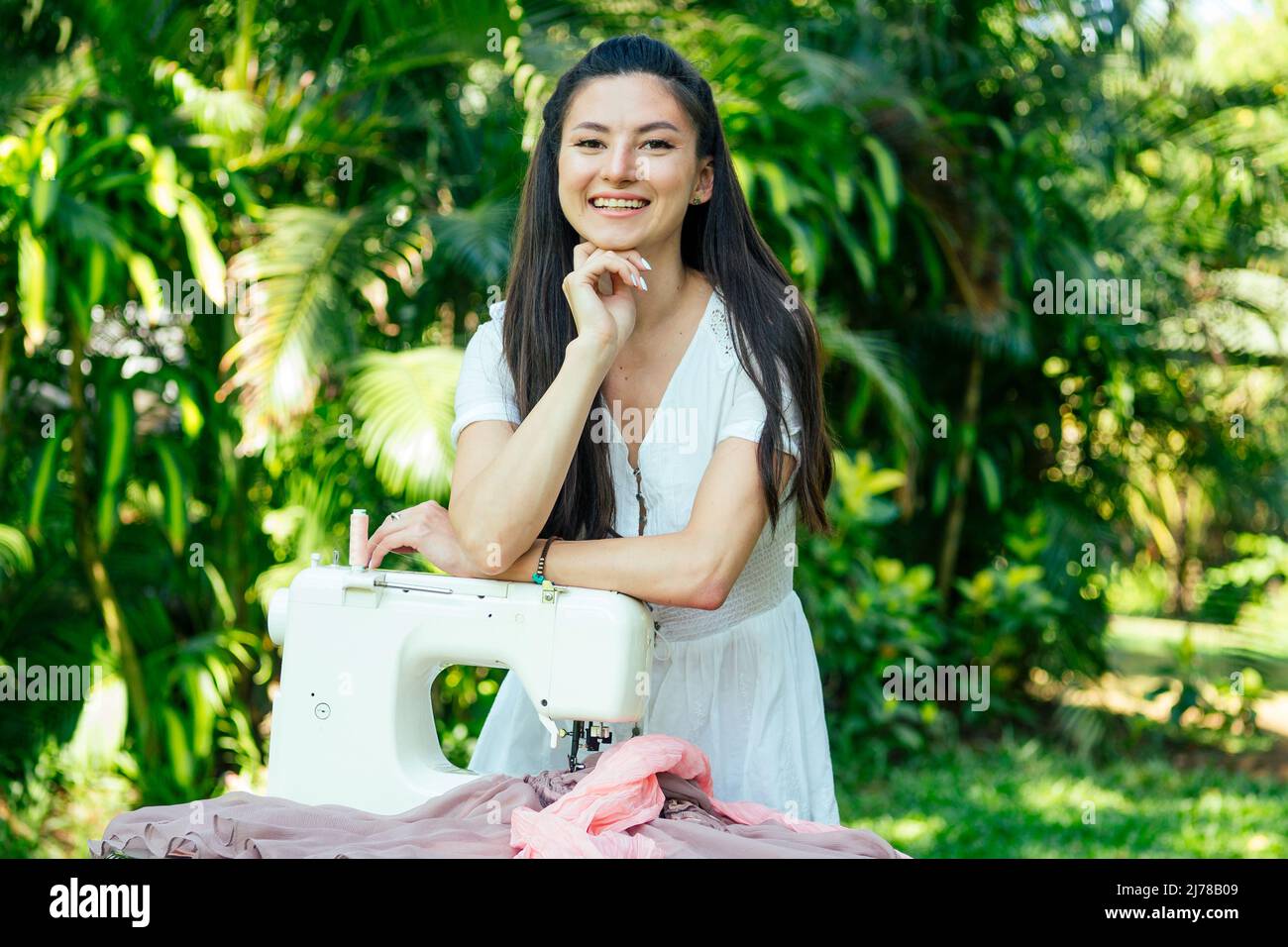 indian female sewing outdoors in summer park Stock Photo - Alamy