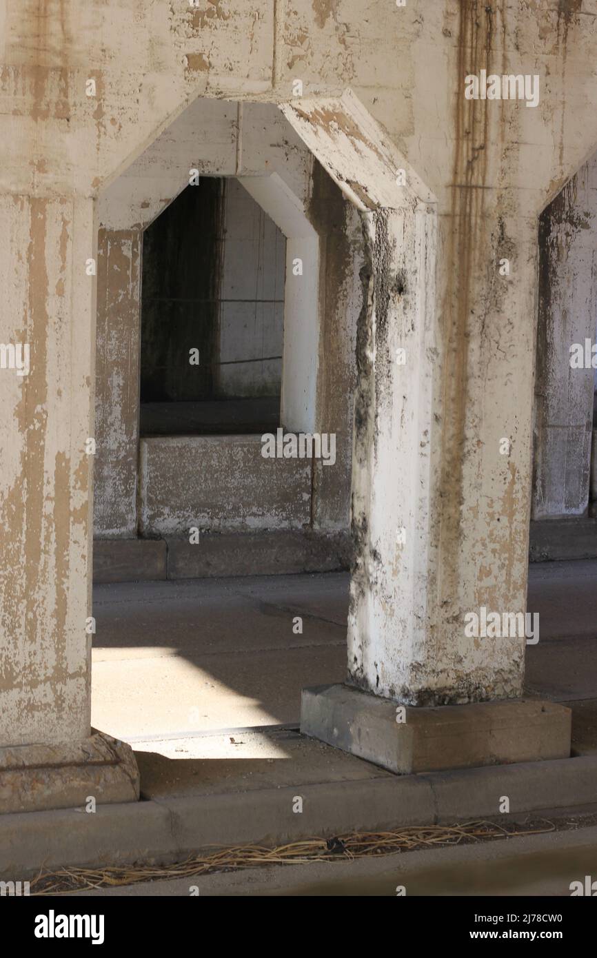 Arcade of concrete columns hold up the railroad bridge Stock Photo - Alamy