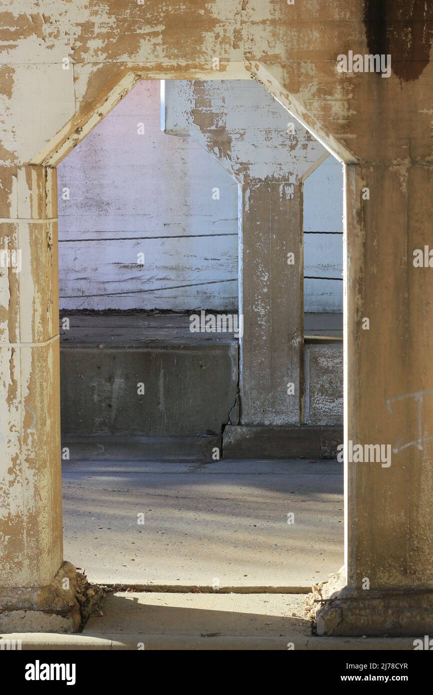 Arcade of concrete columns hold up the railroad bridge Stock Photo - Alamy