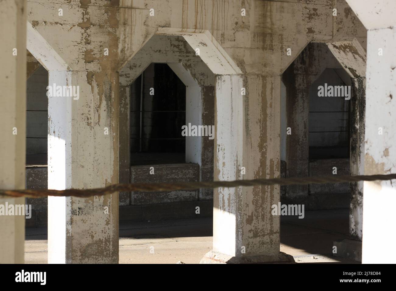 Arcade of concrete columns hold up the railroad bridge Stock Photo - Alamy