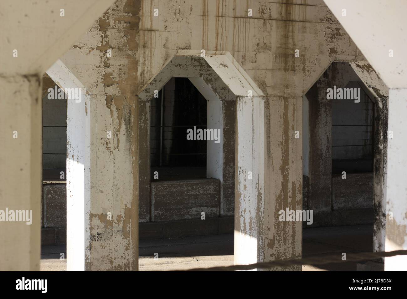 Arcade of concrete columns hold up the railroad bridge Stock Photo - Alamy